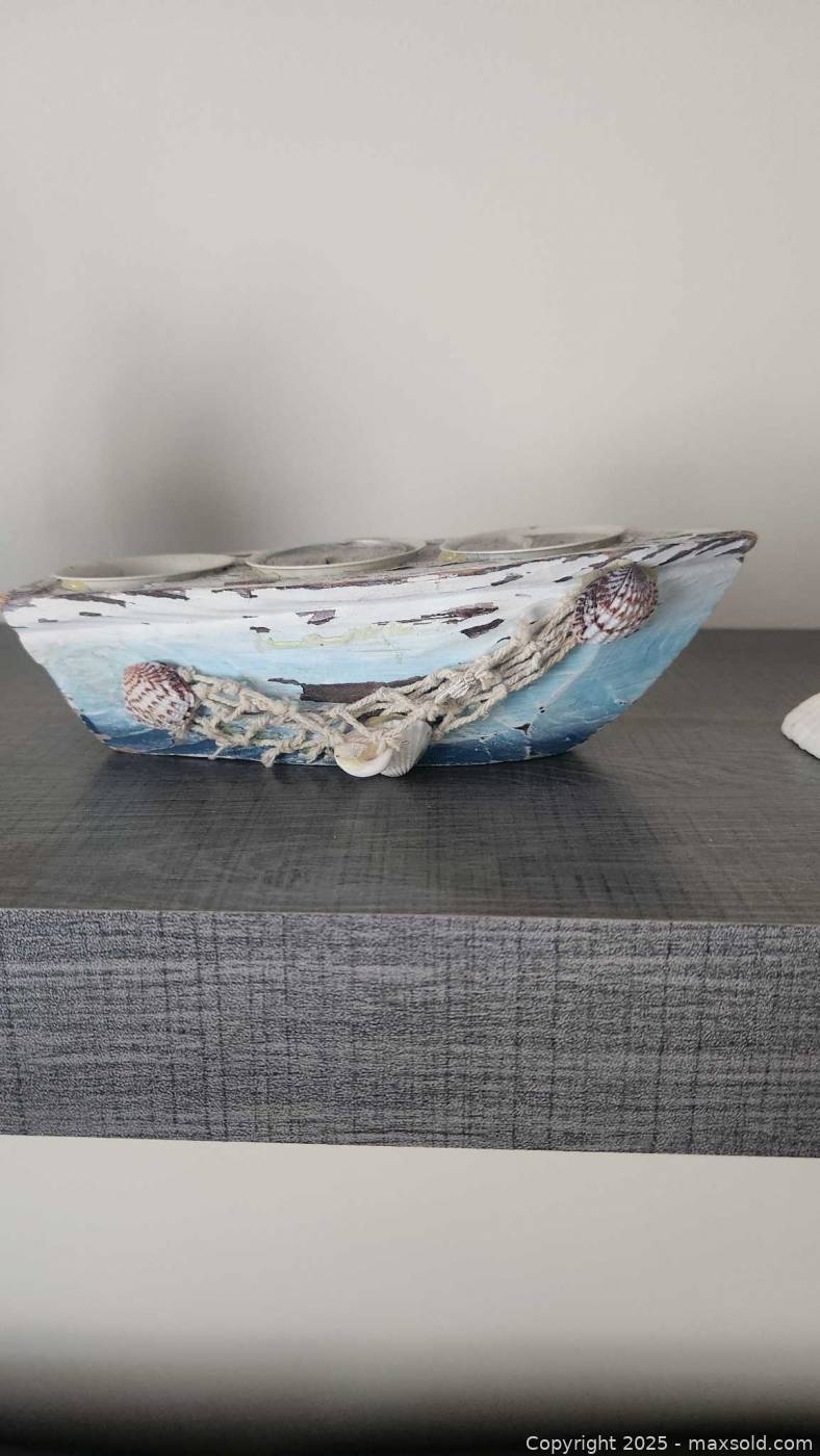 Ceramic fish bank, boat tealight holder, bottle and two seashells | Maxsold
