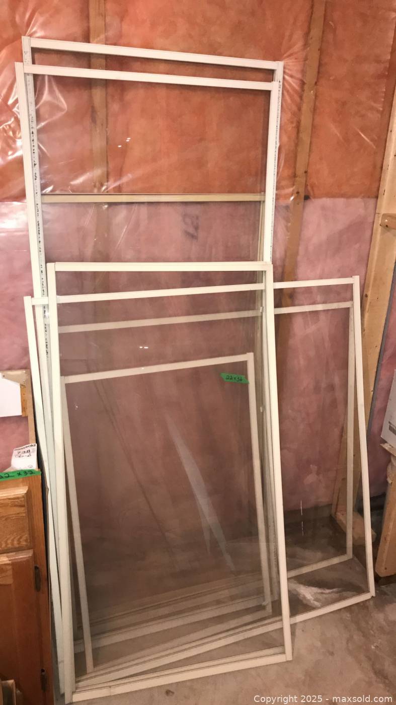 Assorted window screens white frames | Maxsold