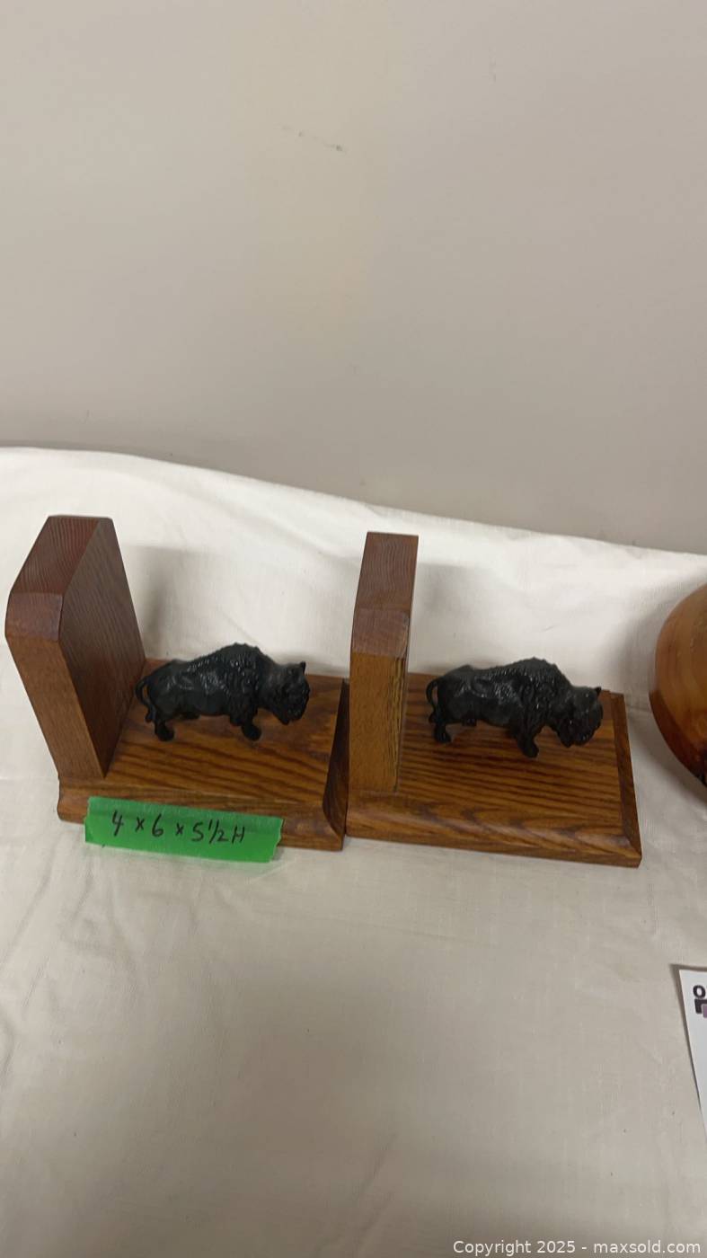 Wooden decor including buffalo bookends, bowl, vase, candleholders ...