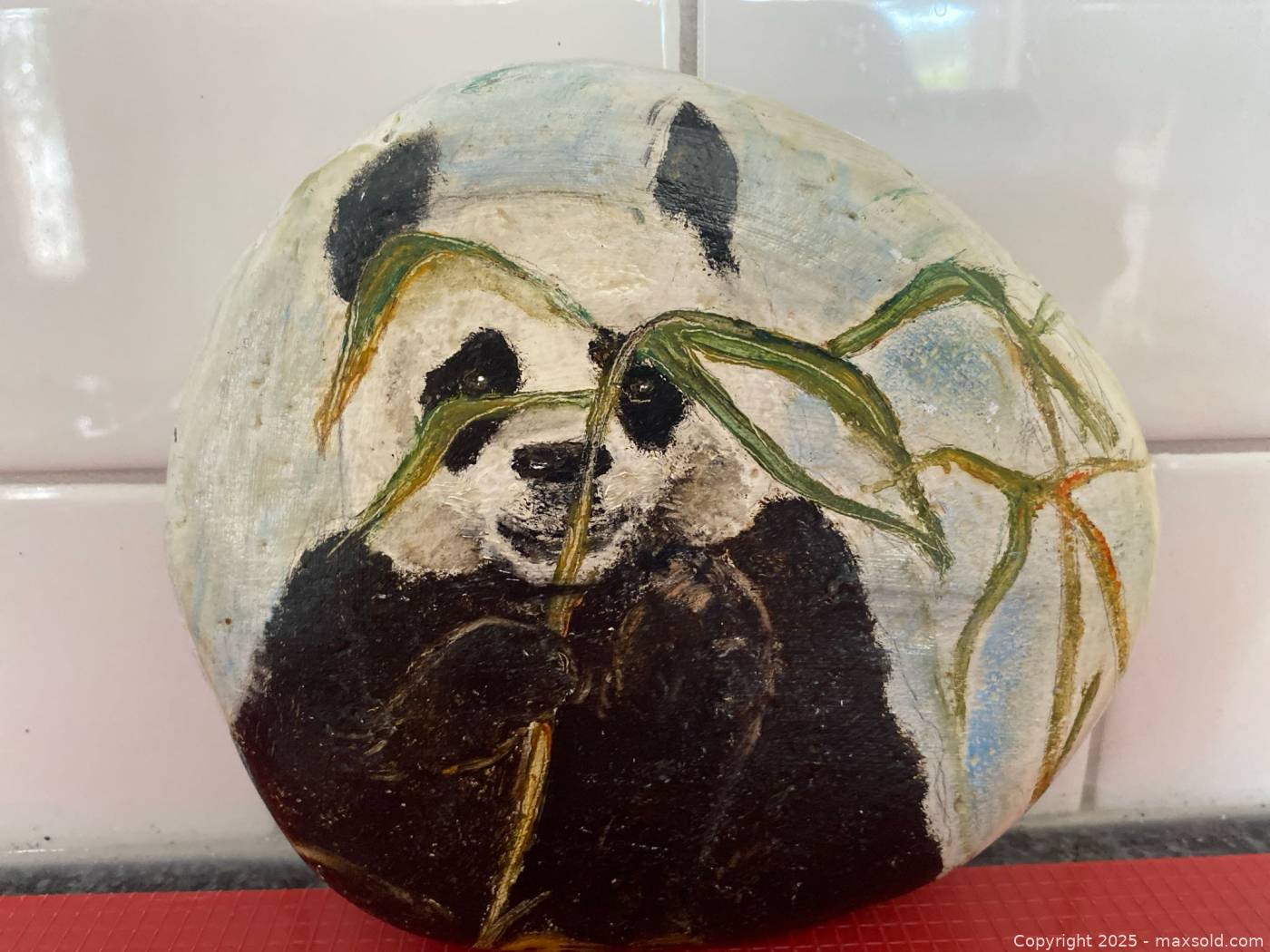 Doreen Spencer hand-painted panda stone | Maxsold