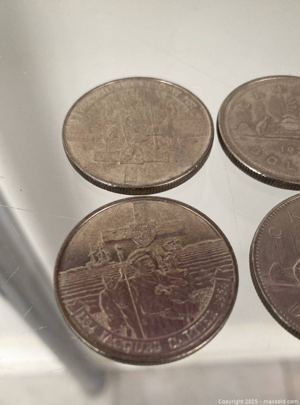 4 Canadian Dollar Coins 1977 1979 1984 | Maxsold