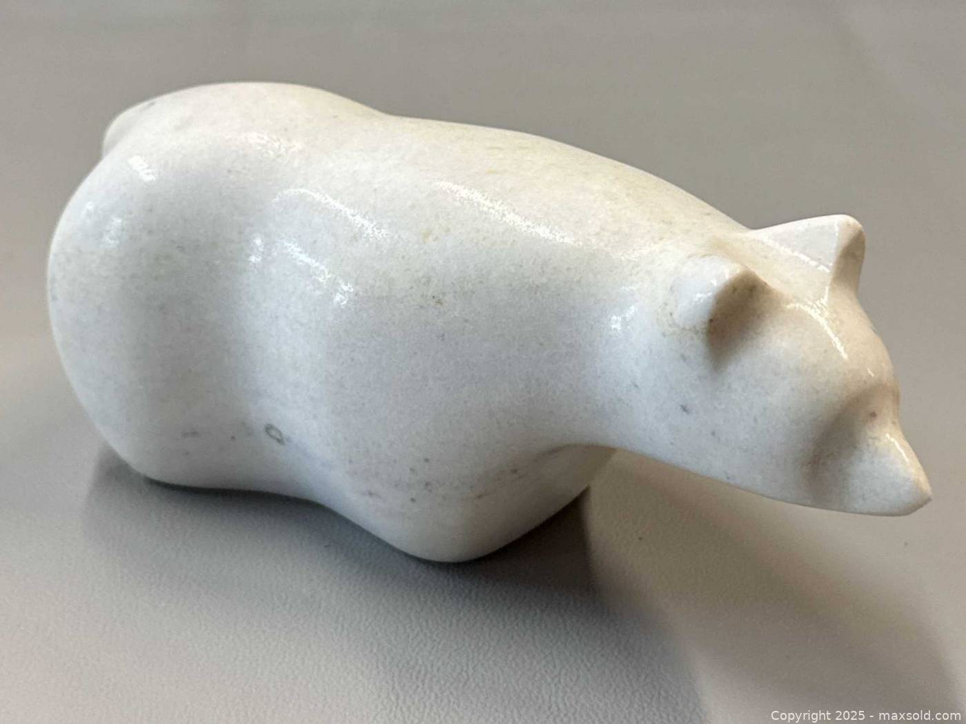 Signed 1967 hand-carved stone polar bear sculpture | Maxsold
