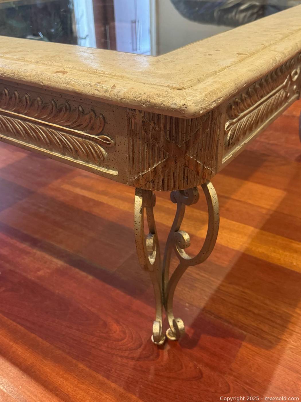 Square glass-top coffee table, faux-stone frame, metal scroll legs ...