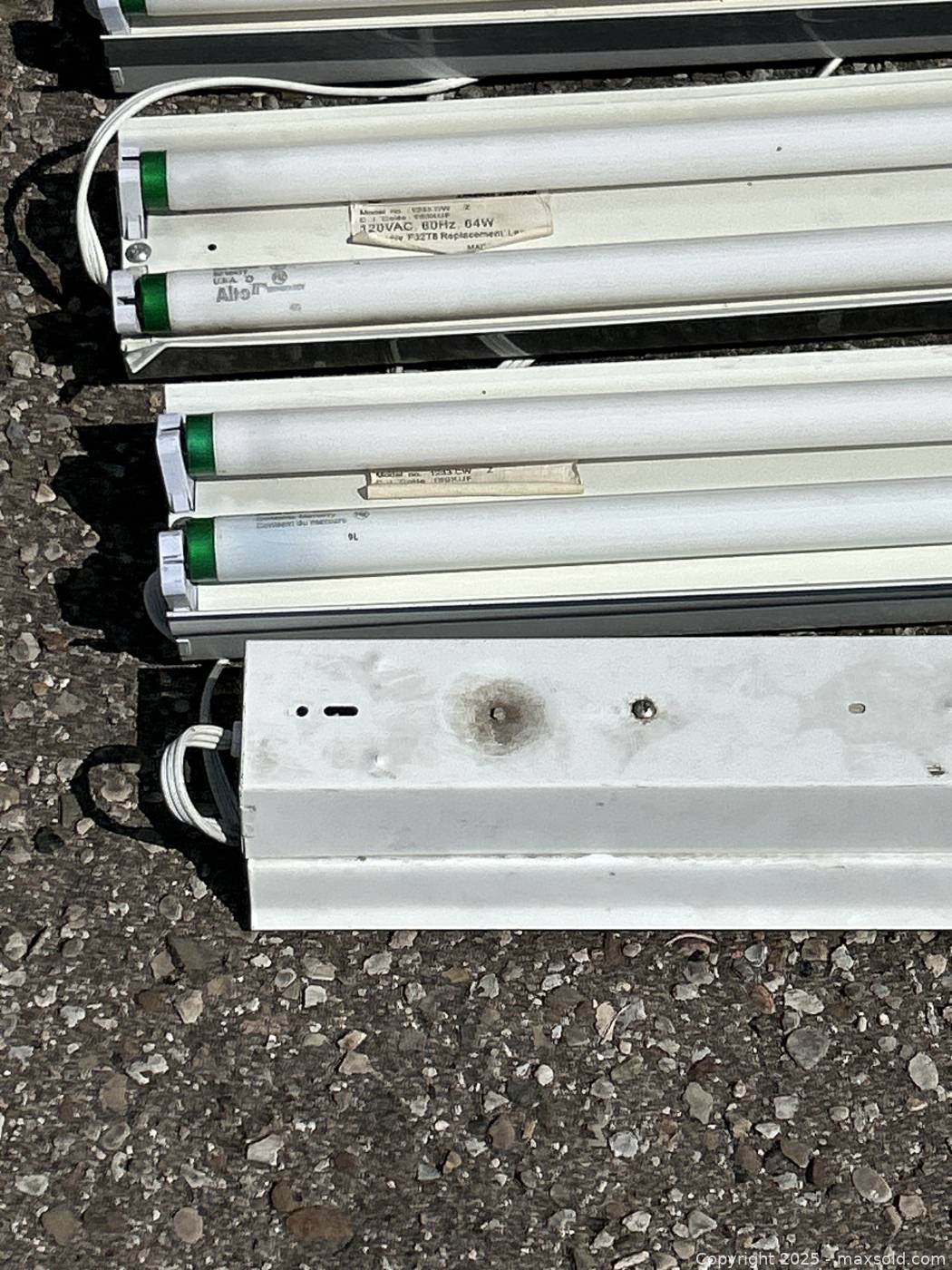 Five 48" plug-in fluorescent light fixtures | Maxsold