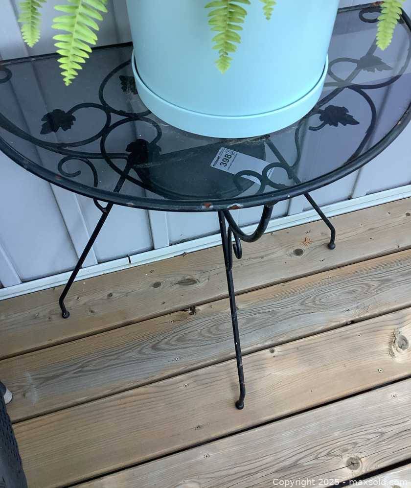 Black metal demilune glass-top table | Maxsold
