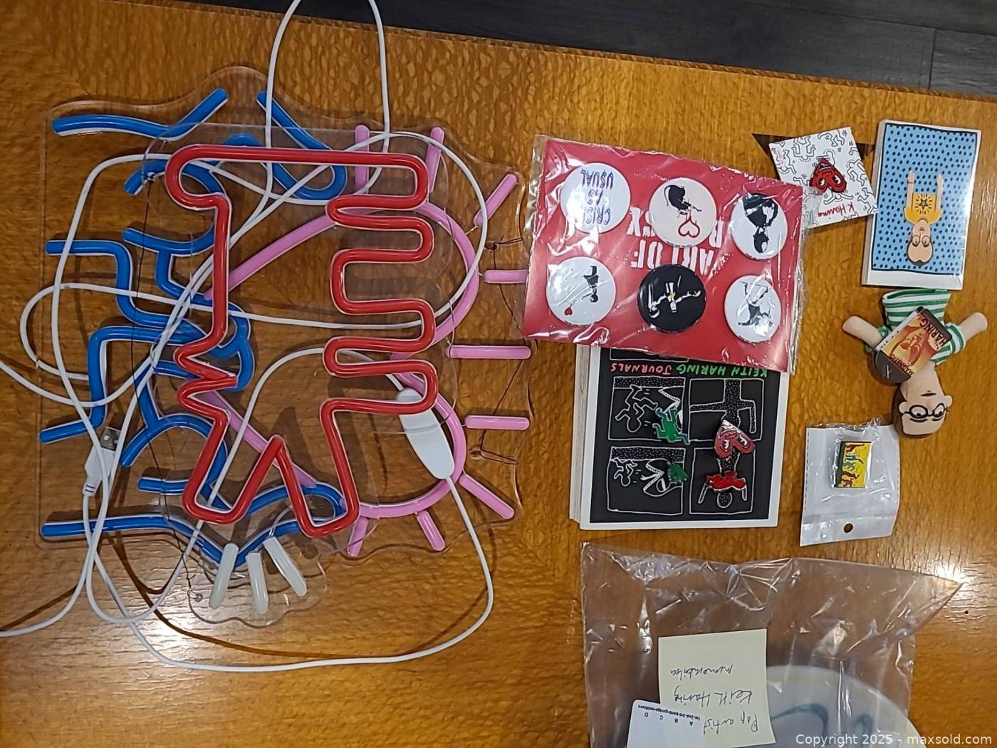 Keith Haring pins, puppet, journals, LED heart light | Maxsold