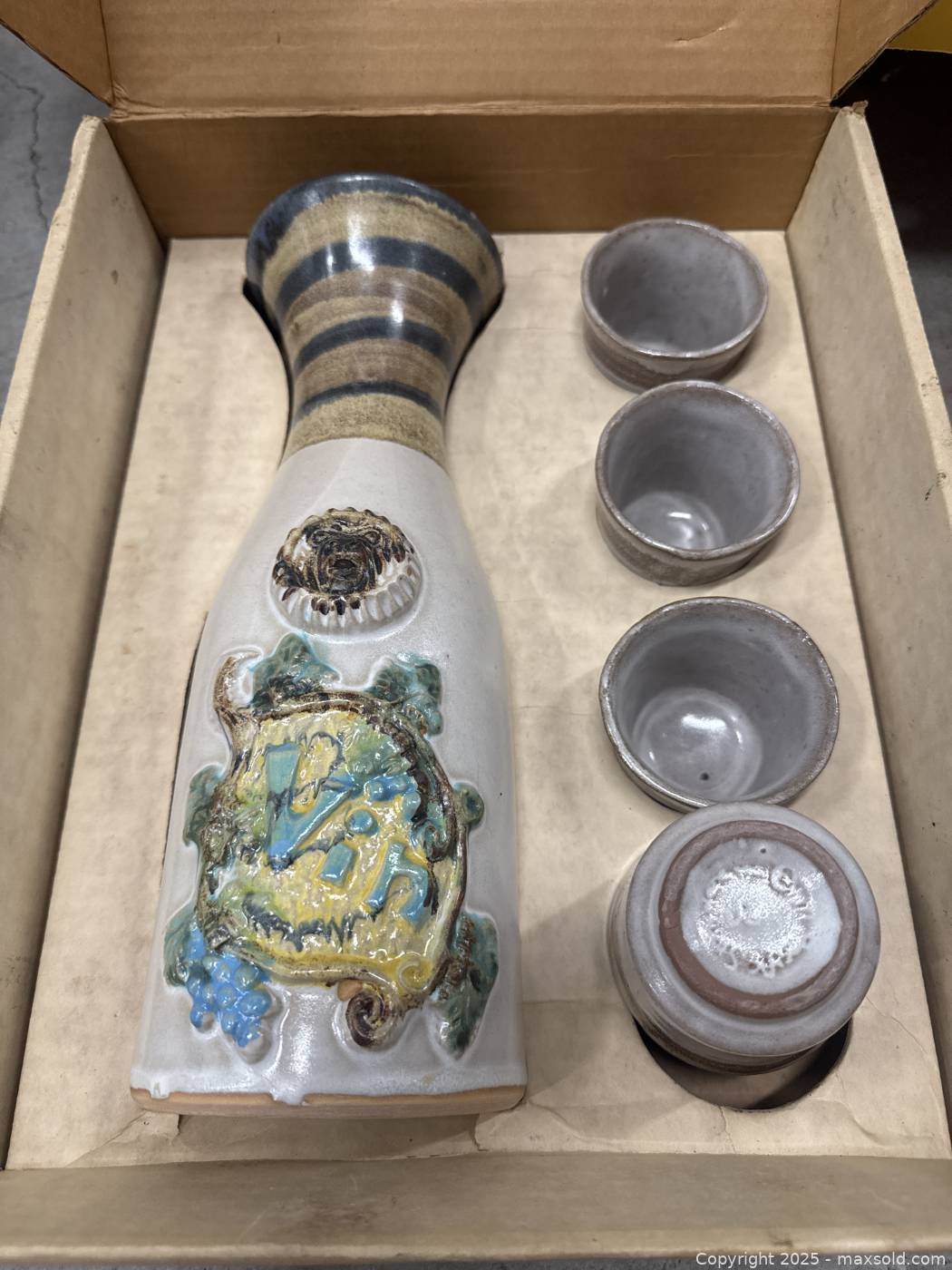 Pacific Stoneware decanter and 4 cups | Maxsold