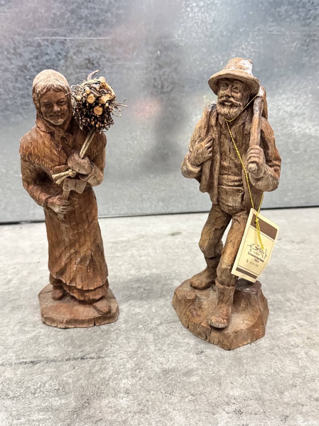 Pair carved wood alpine figurines | Maxsold