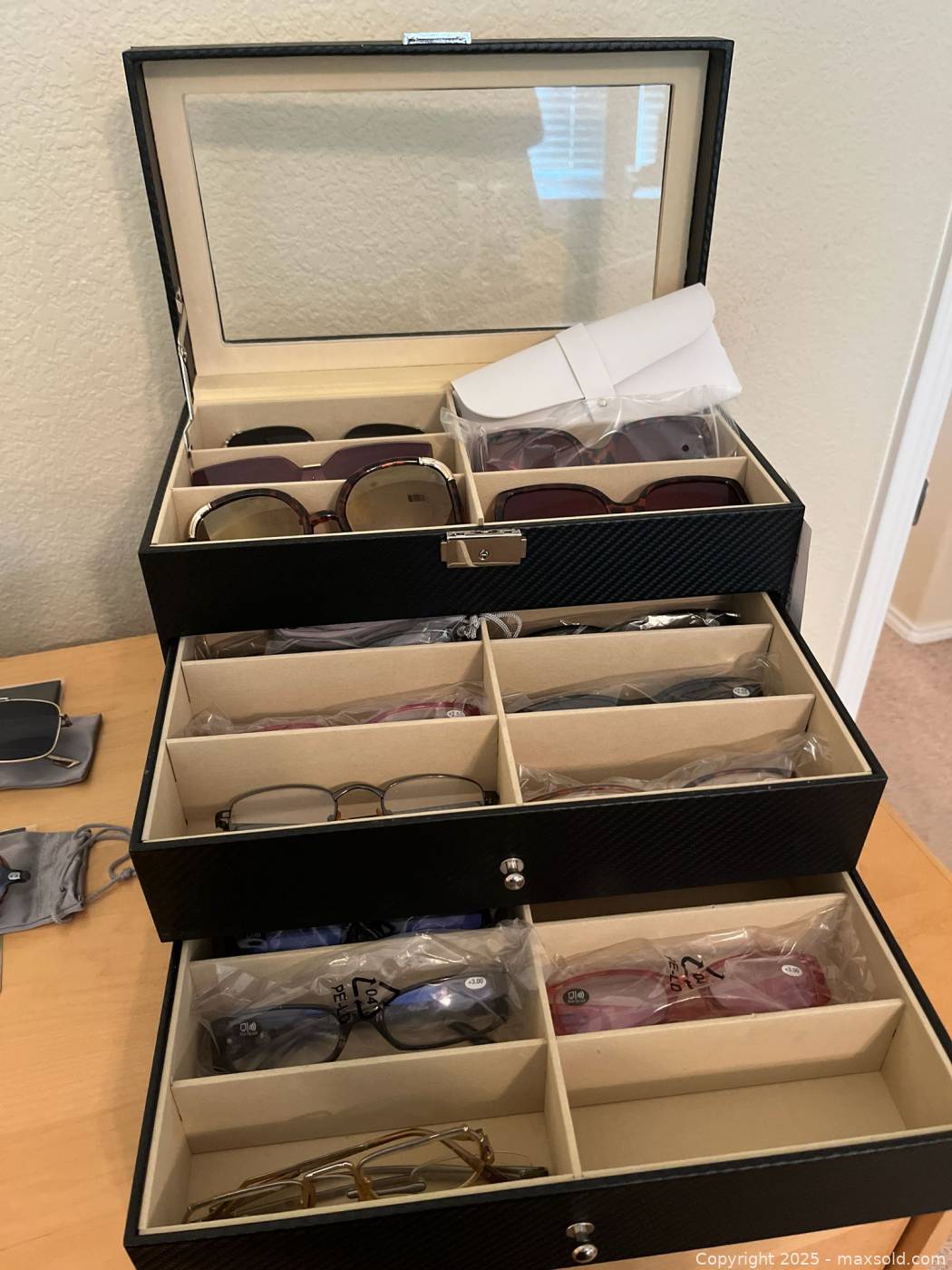 Assorted eyeglasses, sunglasses, 3-tier display case | Maxsold