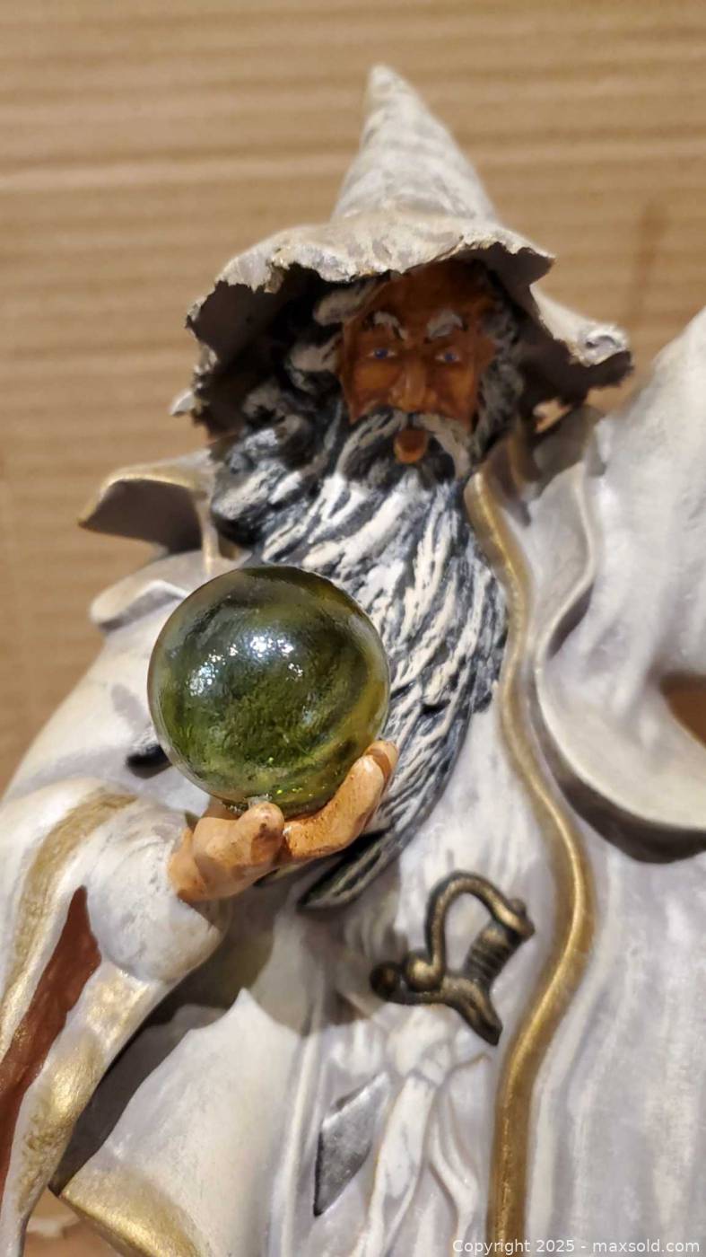 Fantasy wizard statue with staff and orb | Maxsold