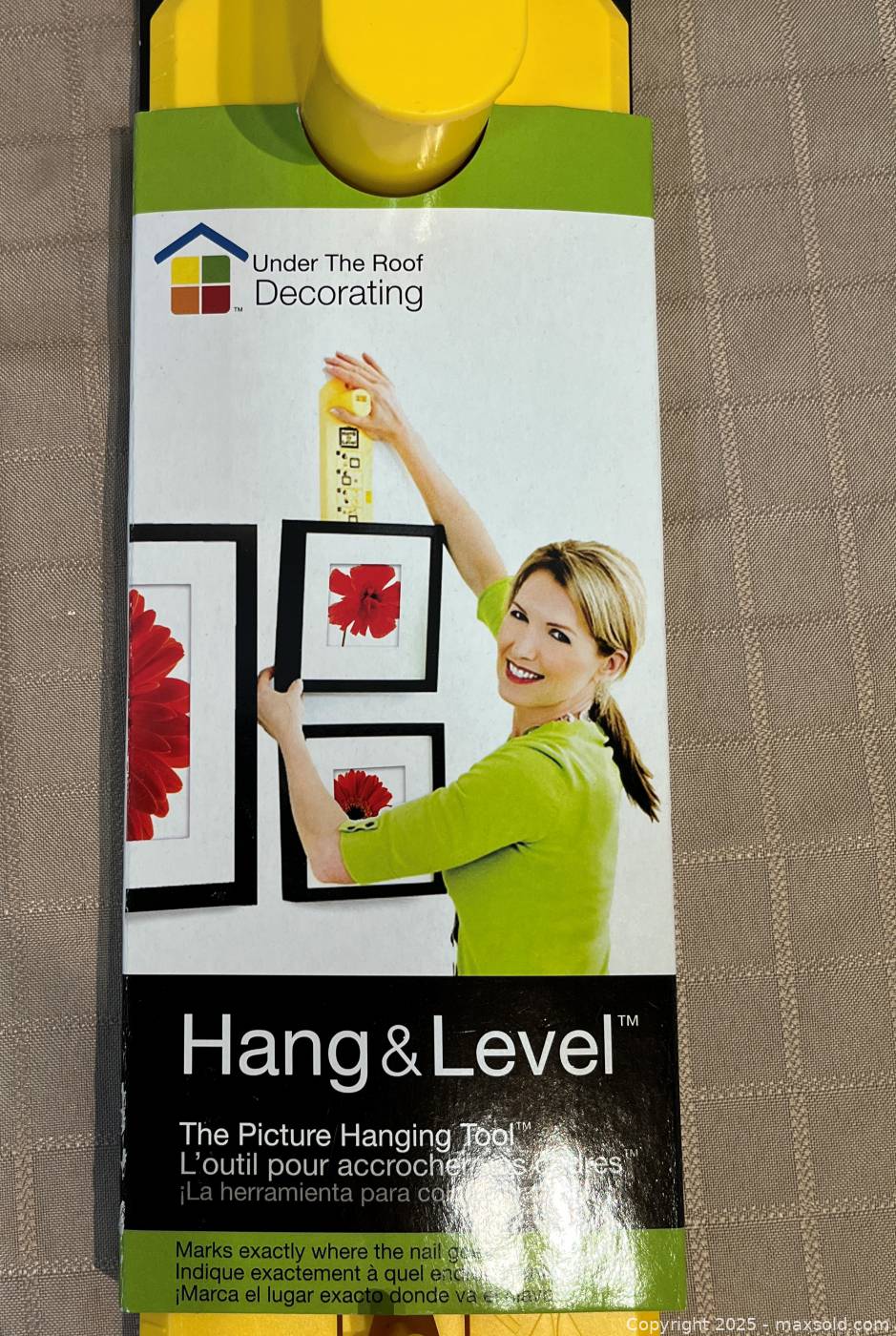 Hang & Level picture hanging tool | Maxsold