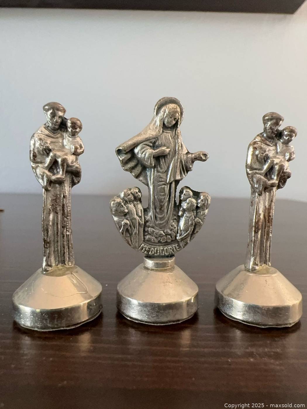 Three magnetic miniature religious statues | Maxsold