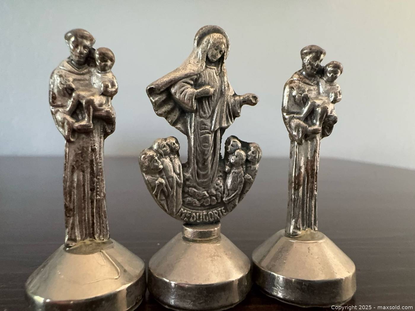 Three magnetic miniature religious statues | Maxsold