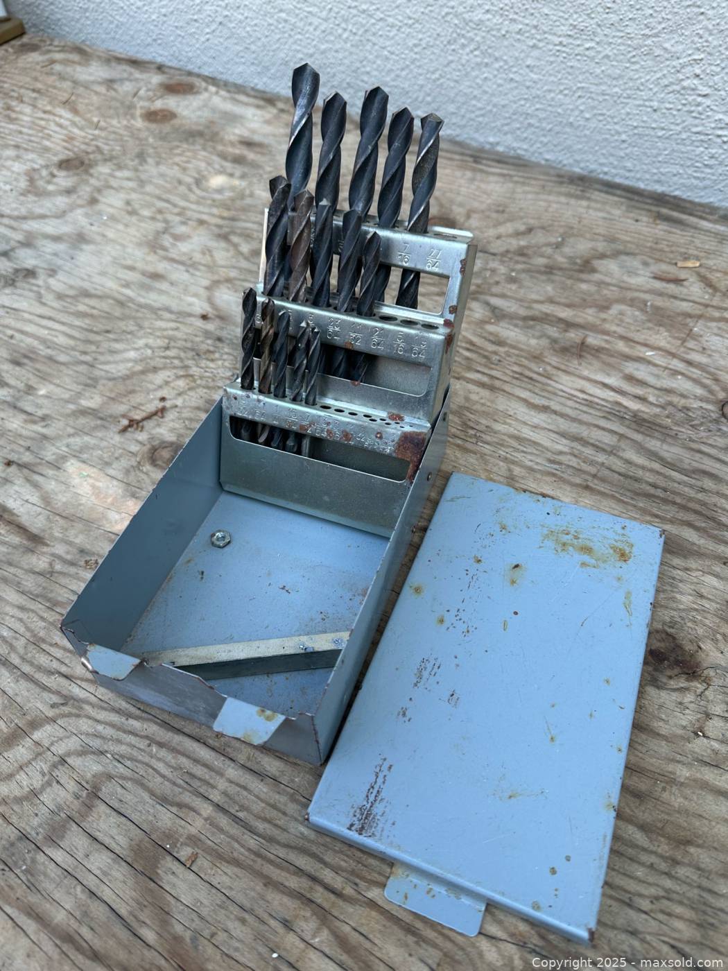 Drill bit index with assorted bits | Maxsold