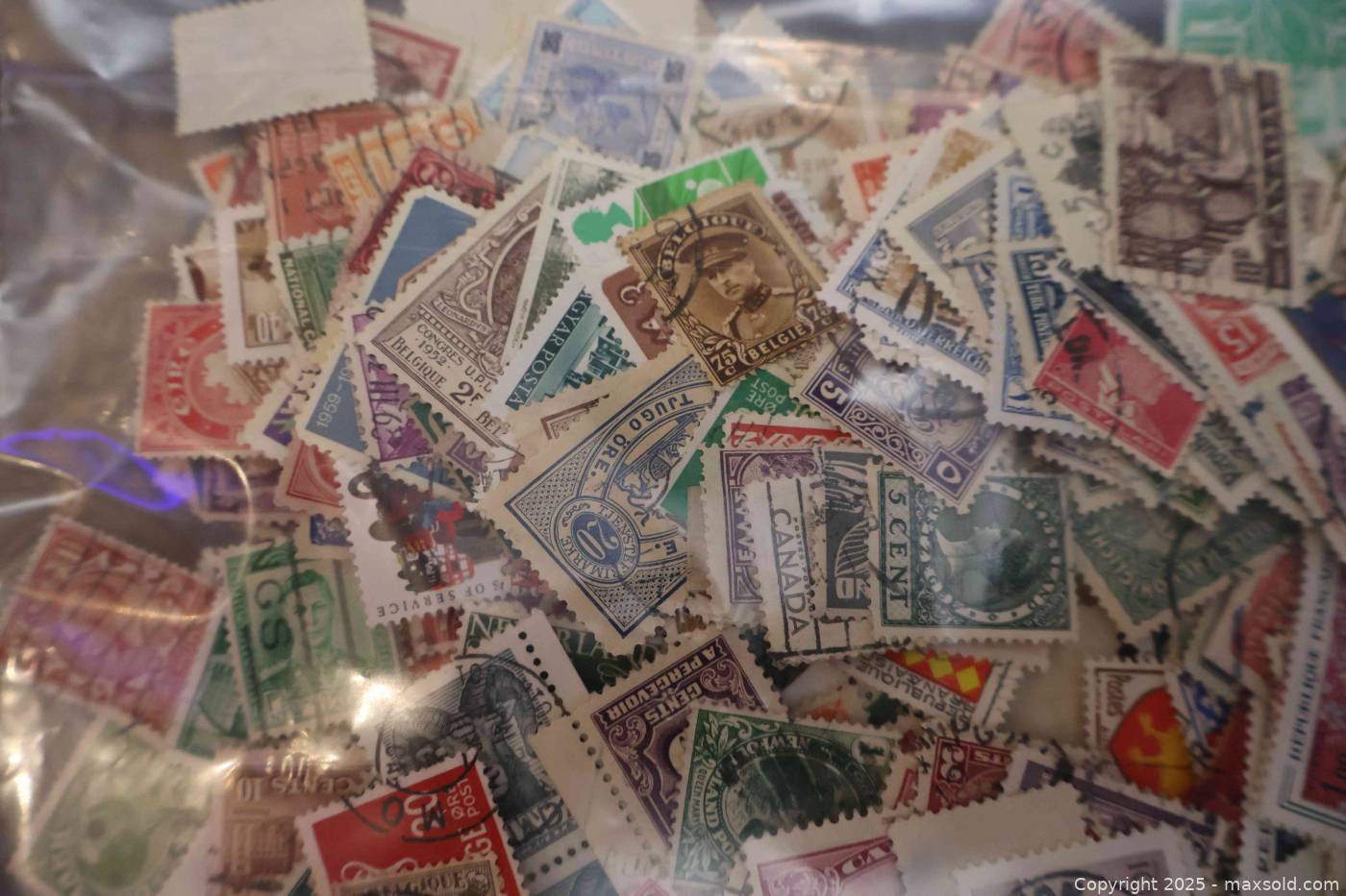 Large bag of worldwide postage stamps | Maxsold