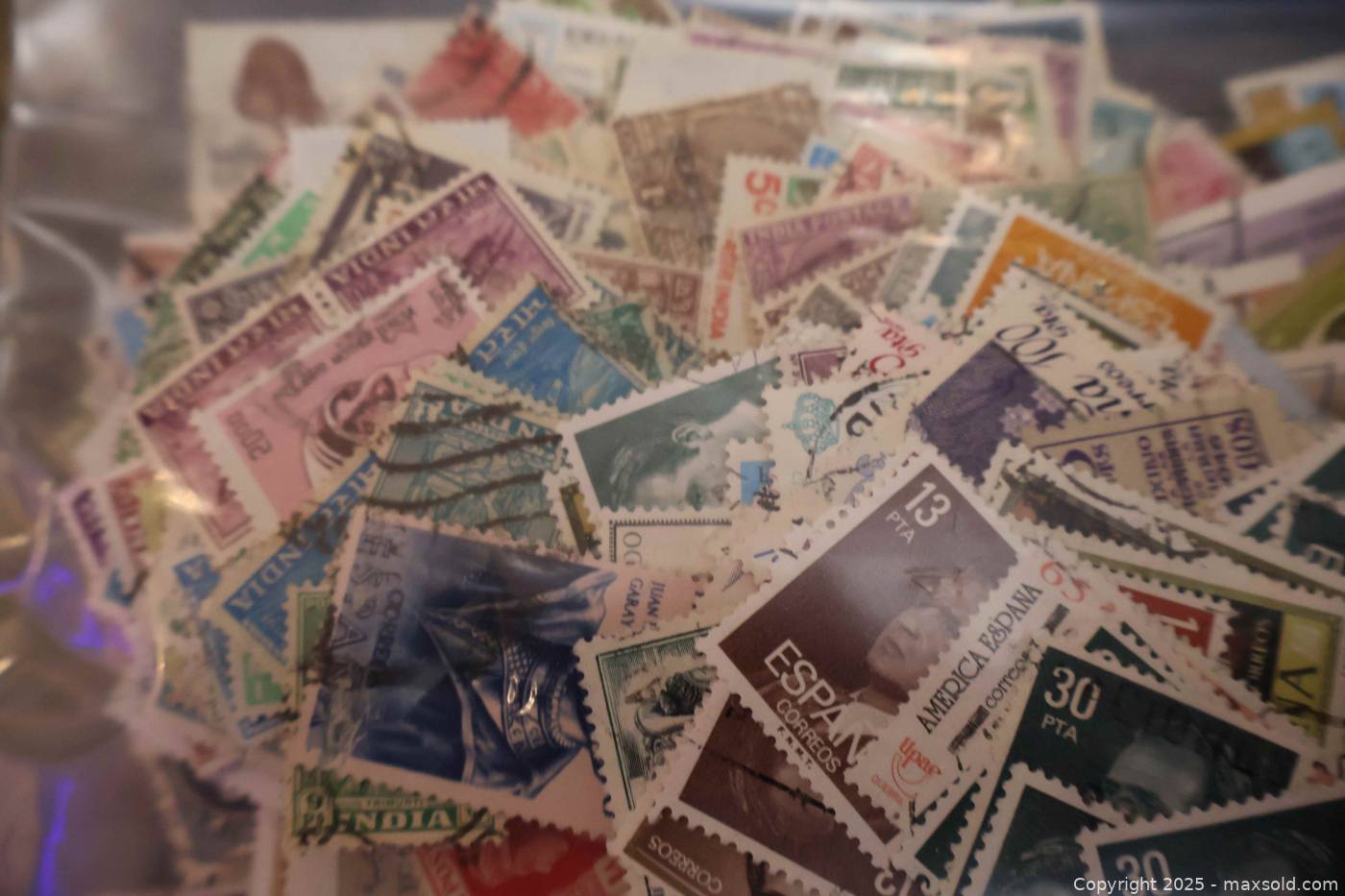 Large bag of worldwide postage stamps | Maxsold