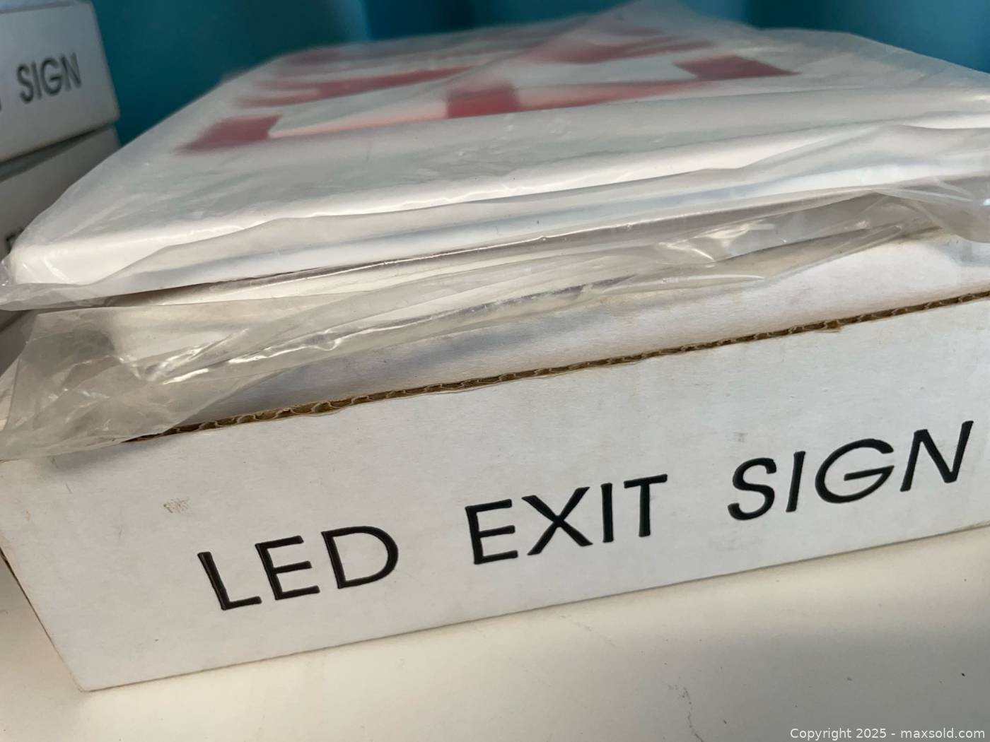 Lelux emergency lights and CNA exit sign | Maxsold