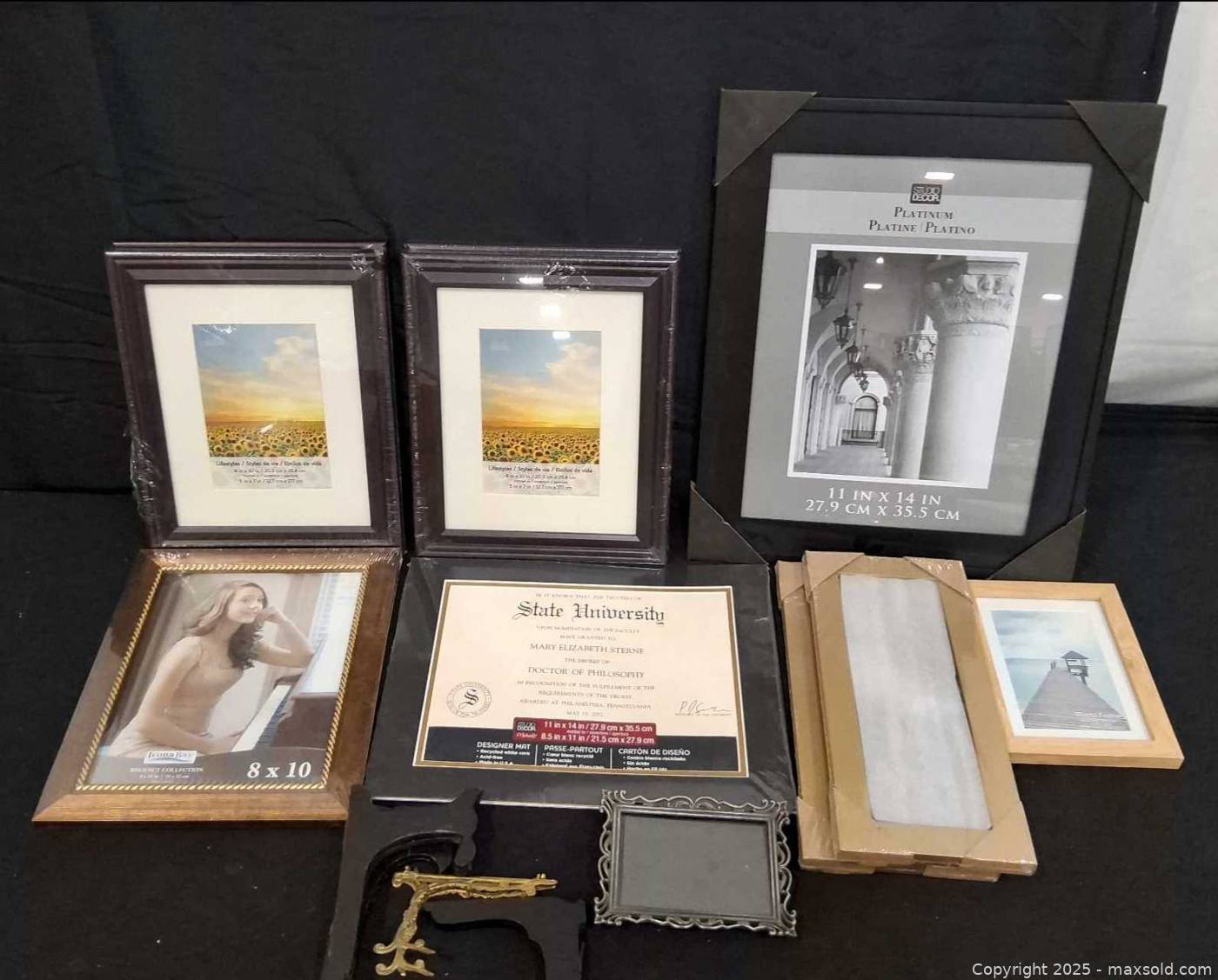 Assorted picture frames and easel stand | Maxsold