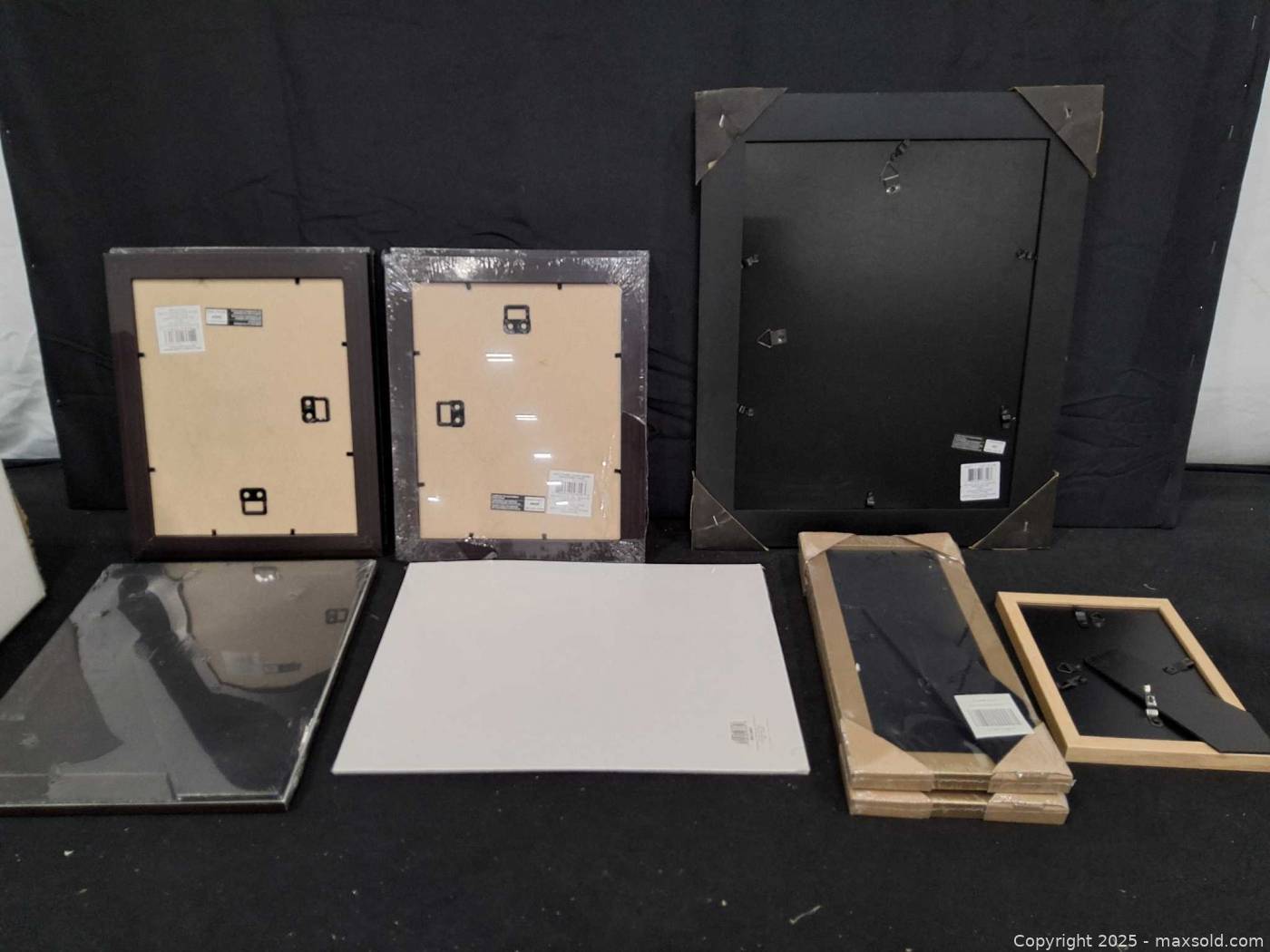 Assorted picture frames and easel stand | Maxsold