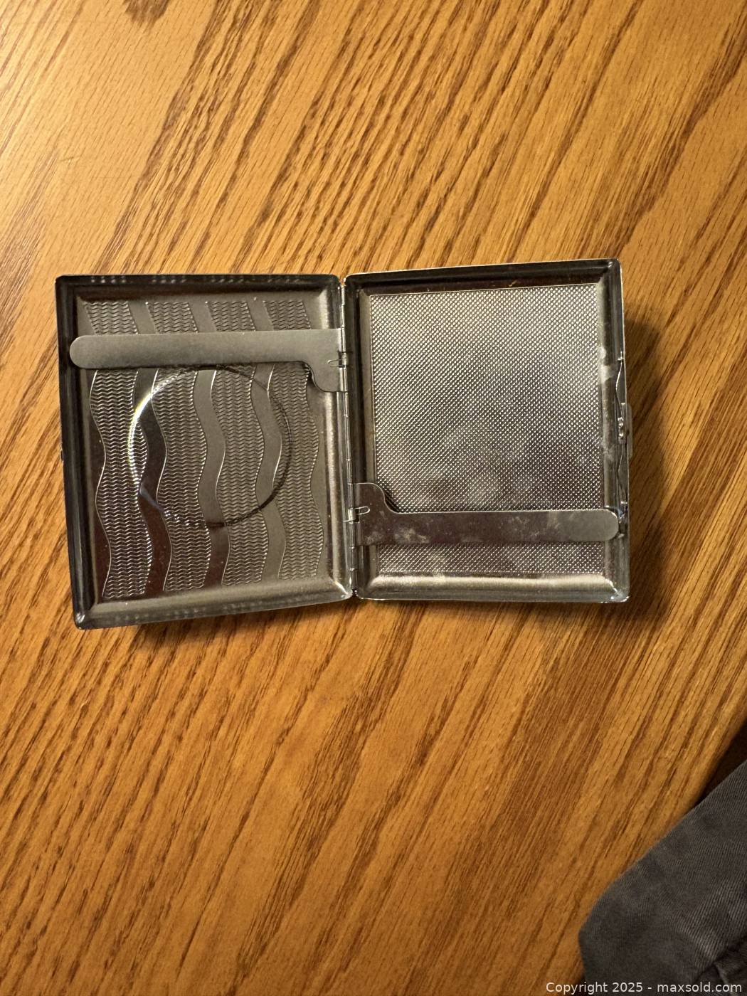 Metal cigarette case with Native American chief motif | Maxsold