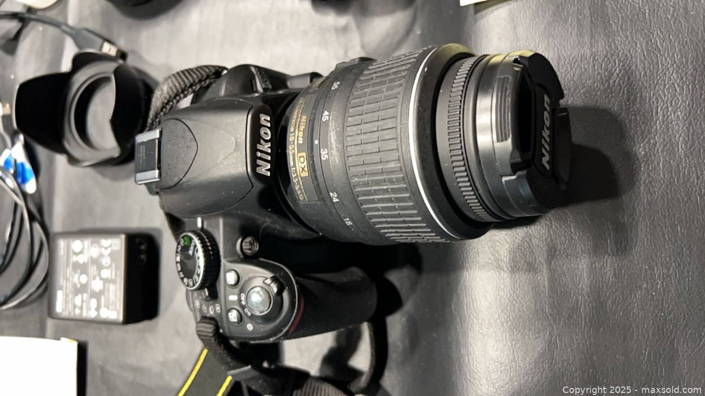 Nikon D3100 DSLR with 18-55mm and 55-200mm lenses, charger, bag ...