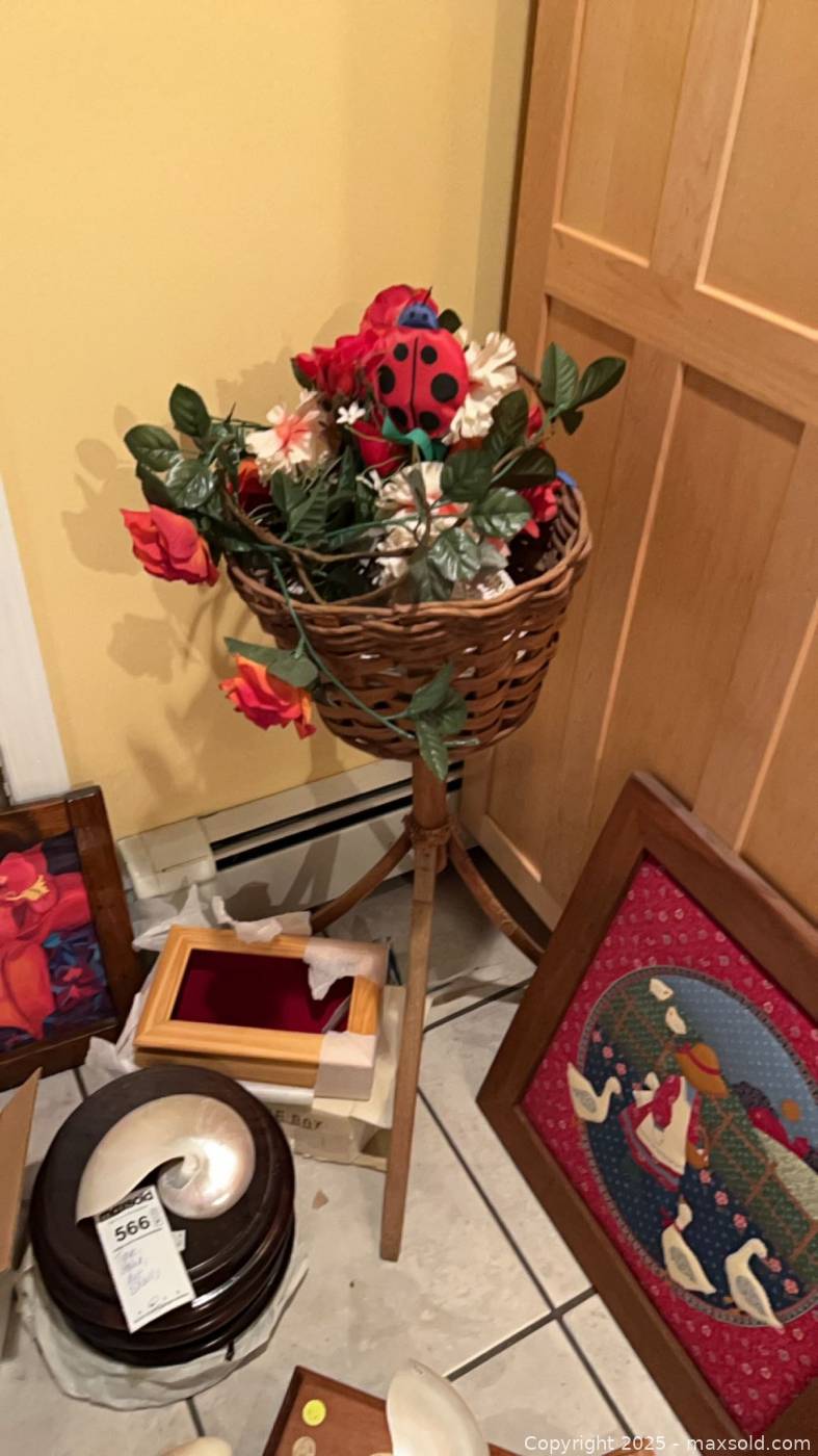 Plant stand, framed art, metal trays, shells | Maxsold