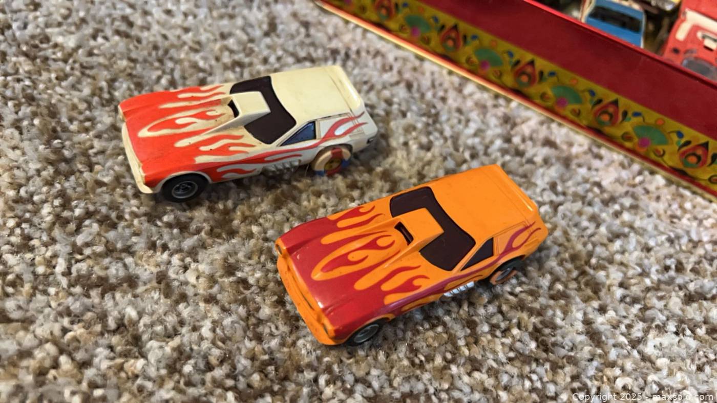Tin with assorted vintage slot cars | Maxsold