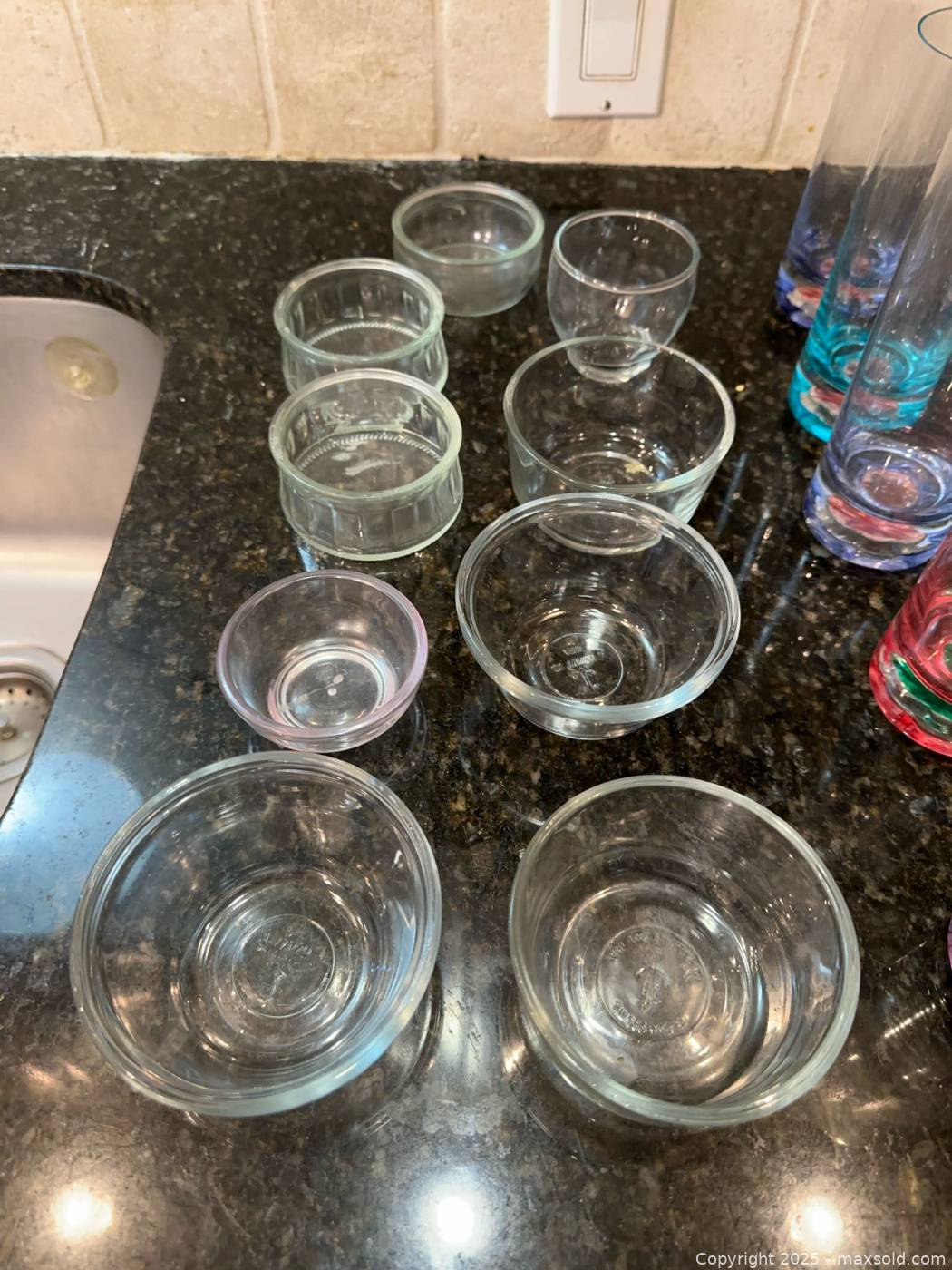 Mixed glassware, bowls, pitcher, thermos, ceramic pieces | Maxsold