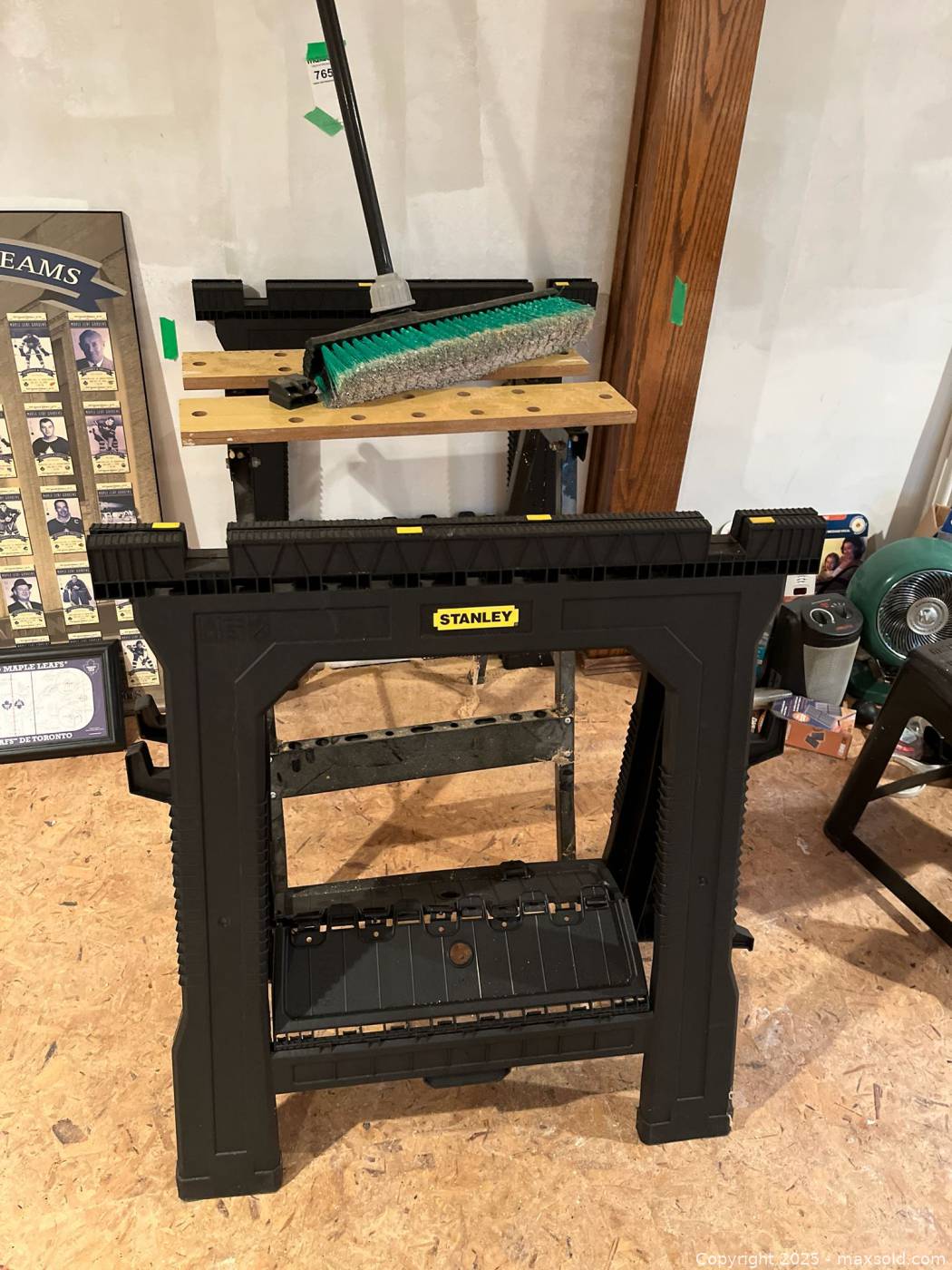 Stanley plastic sawhorses and WorkMate folding workbench | Maxsold