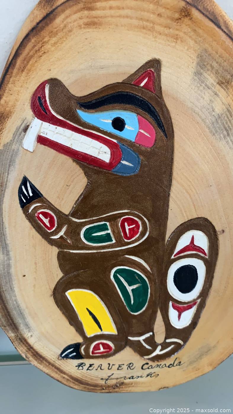 Two signed Indigenous beaver wood plaques | Maxsold