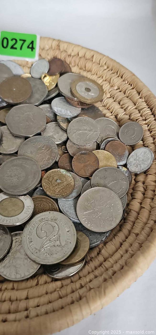 Basket of assorted vintage foreign coins | Maxsold