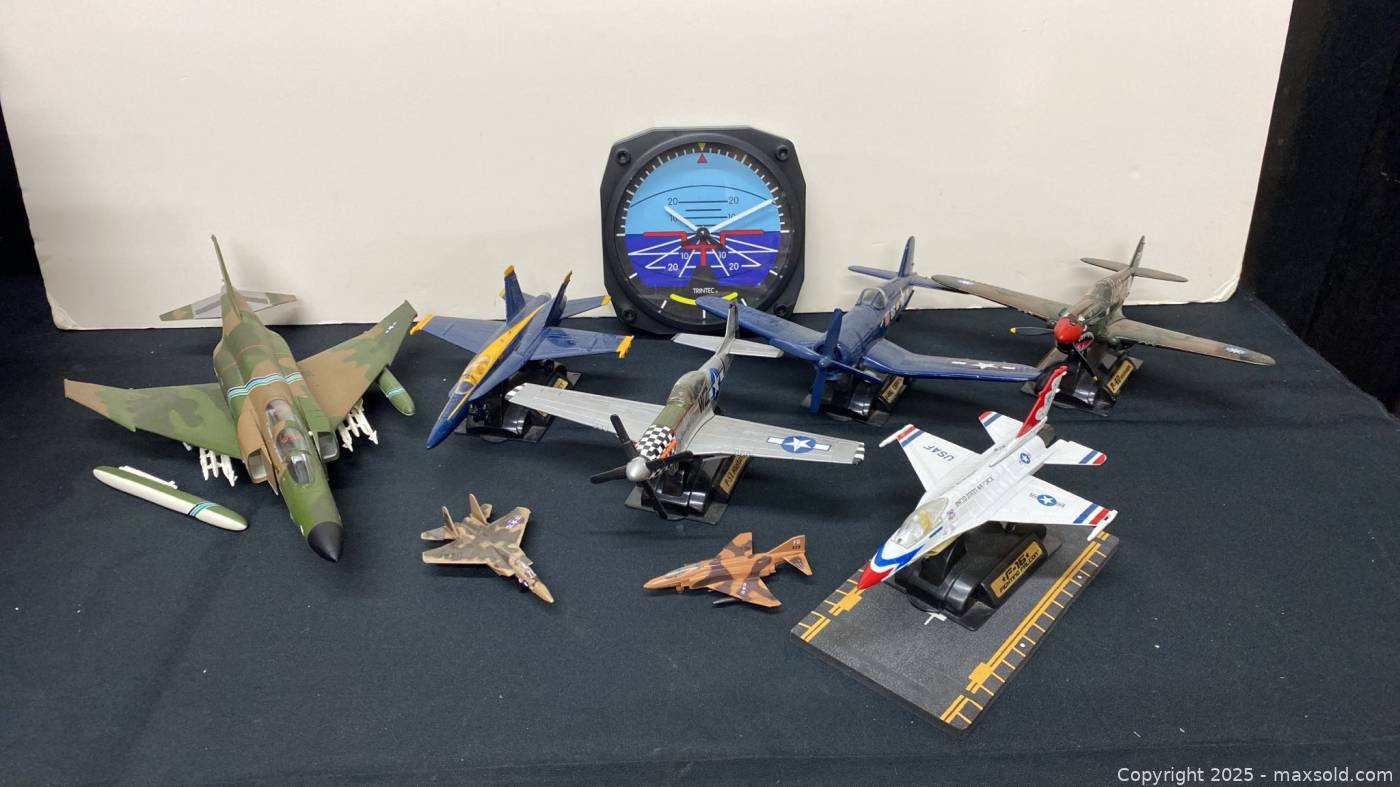 Assorted scale model fighter aircraft with clock | Maxsold