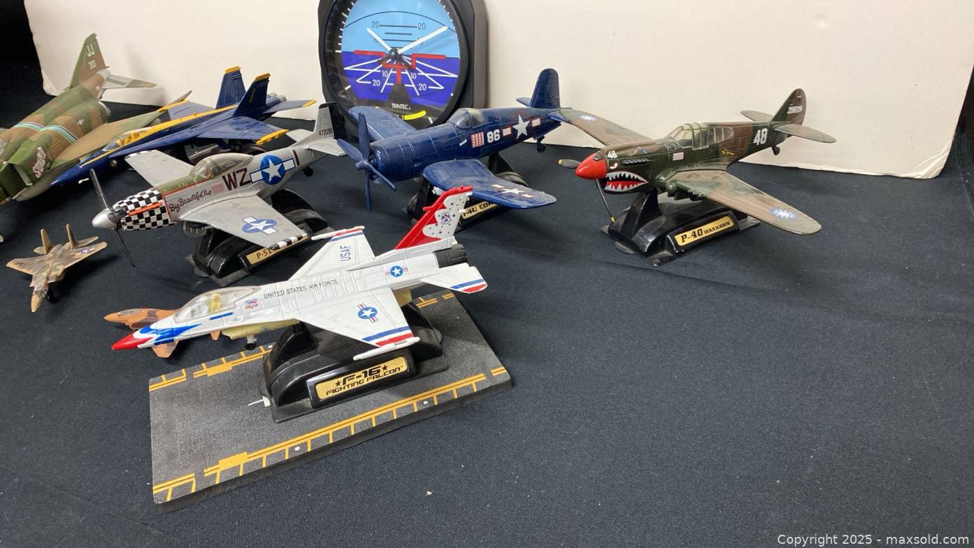 Assorted scale model fighter aircraft with clock | Maxsold