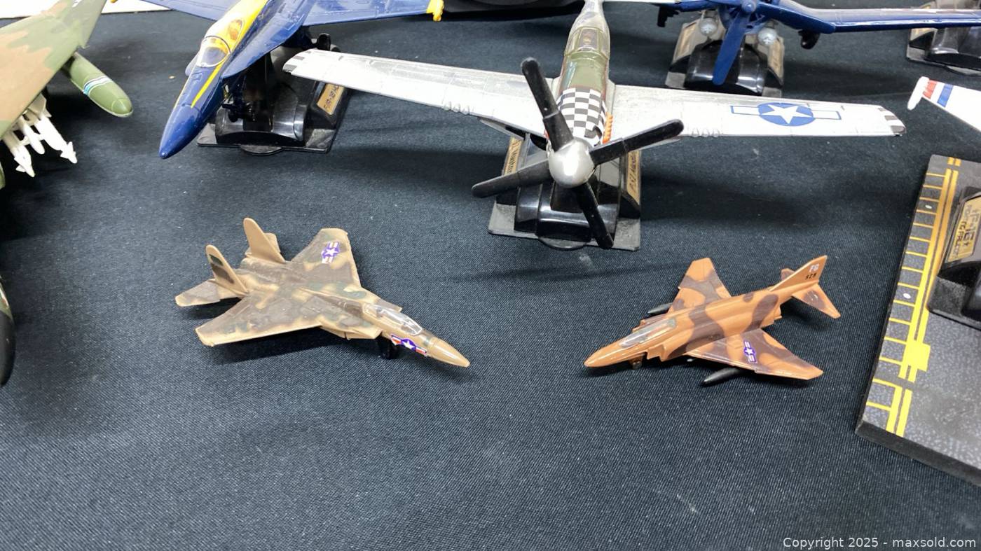 Assorted scale model fighter aircraft with clock | Maxsold