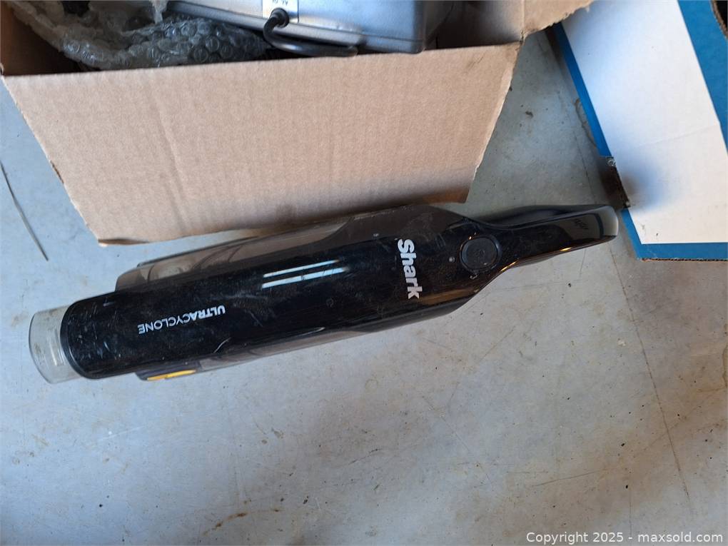 Shark handheld vacuum, cords, hardware | Maxsold
