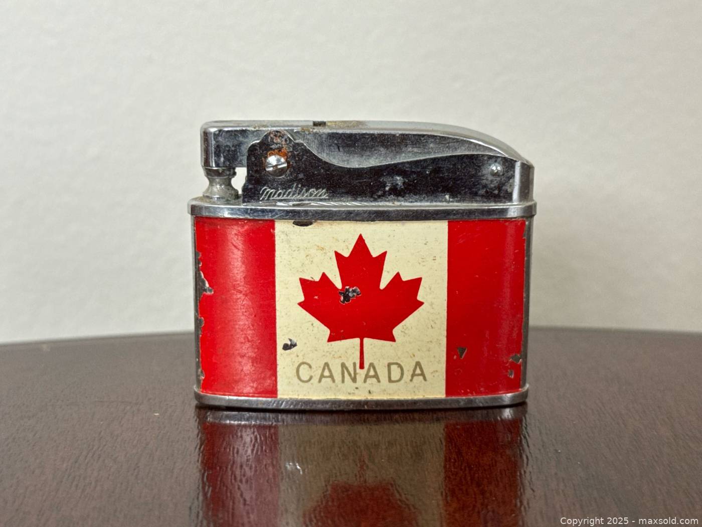 Canadian memorabilia plate lighter bottle | Maxsold