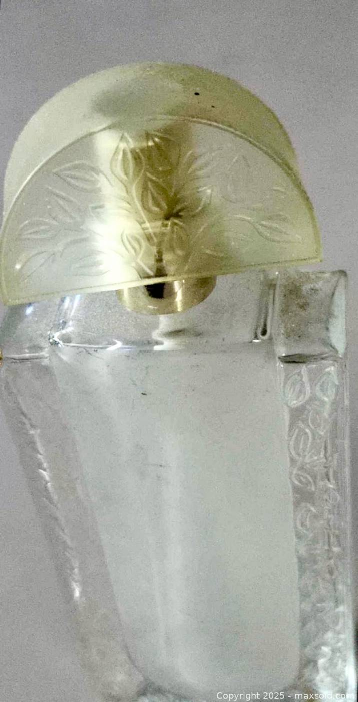 Two Lalique empty crystal perfume bottles | Maxsold