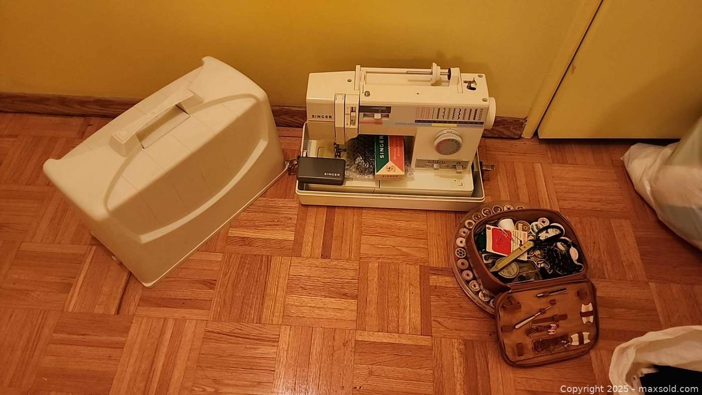 Singer electric sewing machine with notions | Maxsold