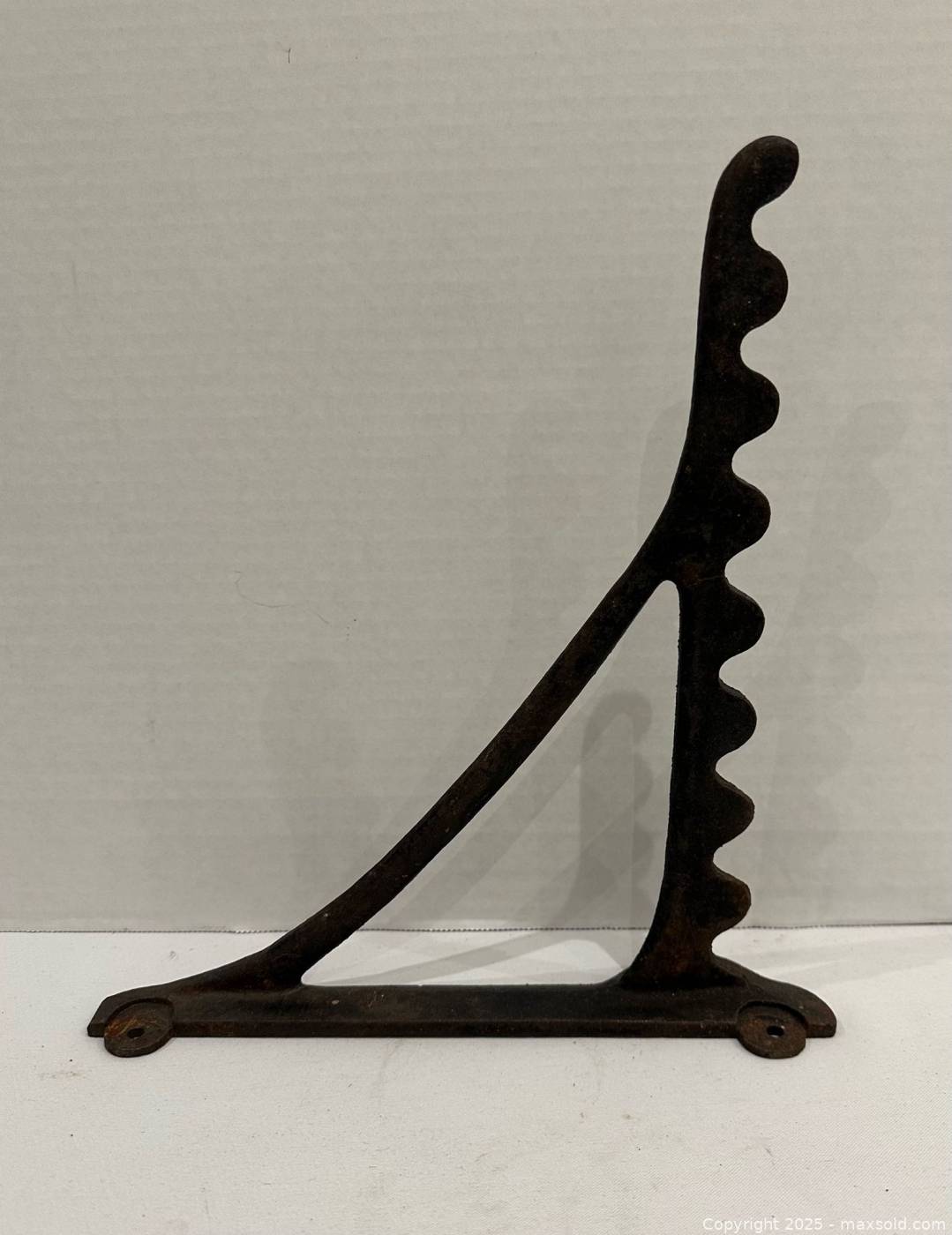 Antique cast iron wall hanger bracket | Maxsold
