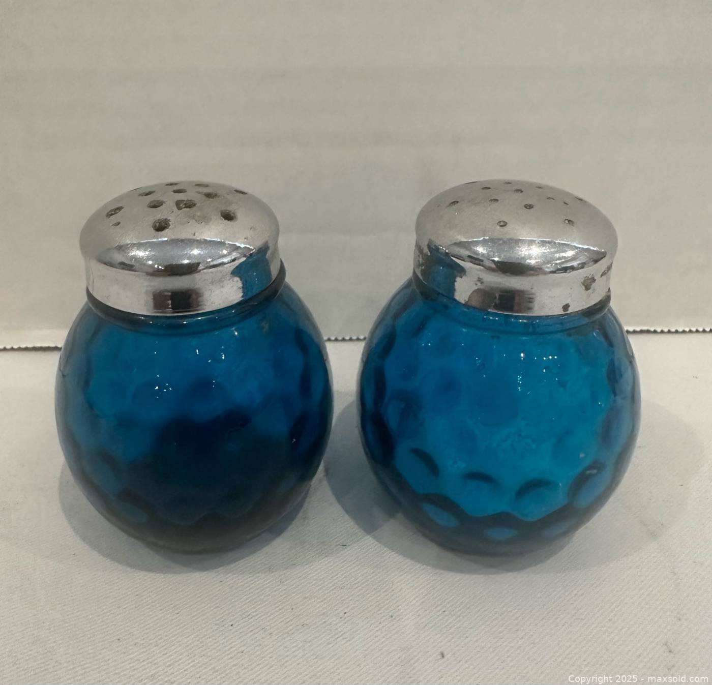 Vintage blue glass salt and pepper shakers | Maxsold
