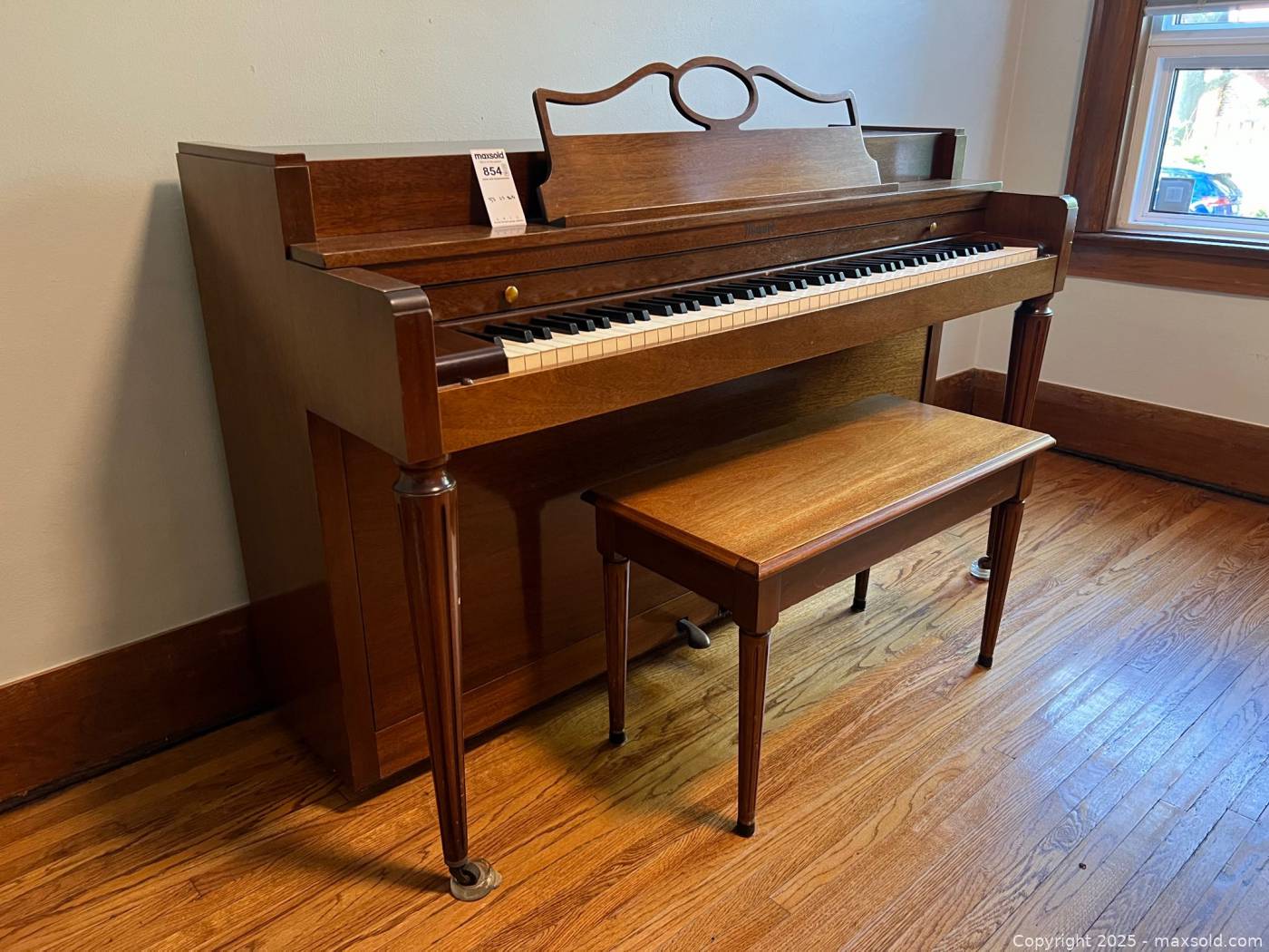 Howard walnut upright piano with bench | Maxsold