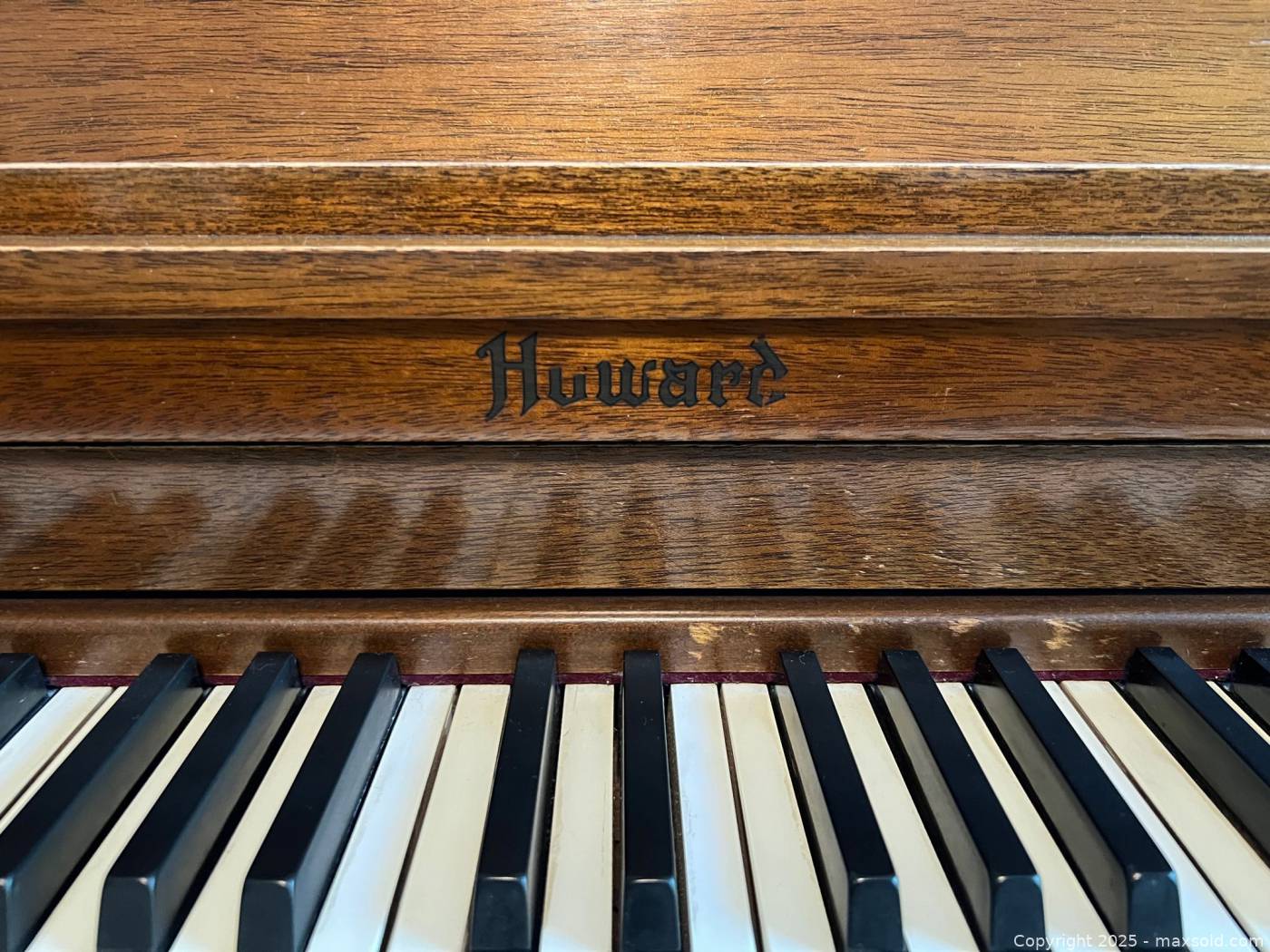 Howard walnut upright piano with bench | Maxsold
