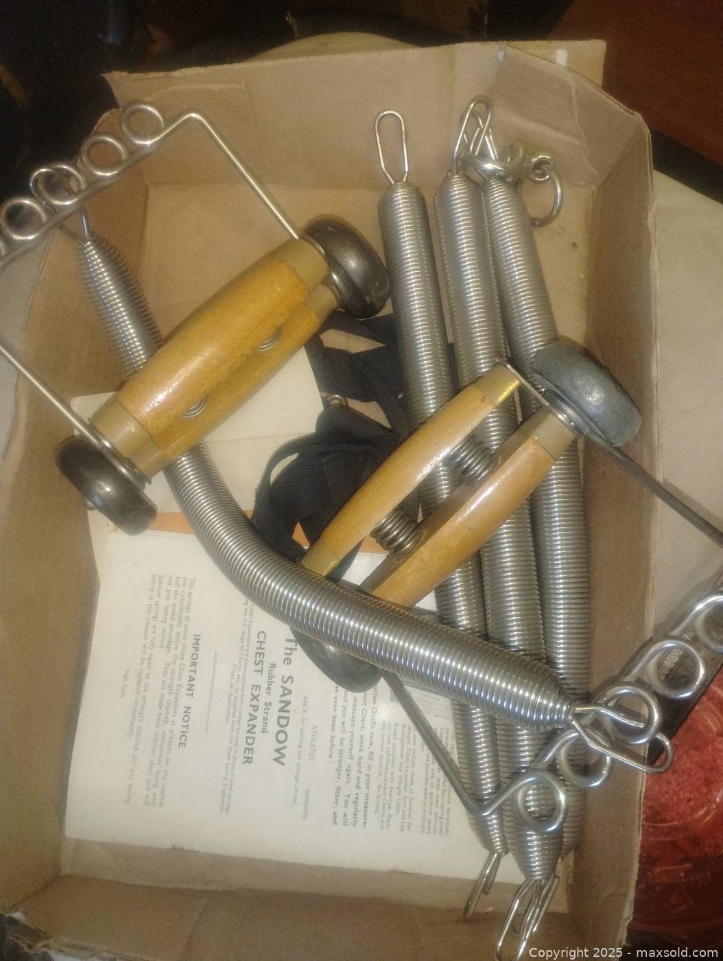 Antique exercise springs with wooden handles | Maxsold