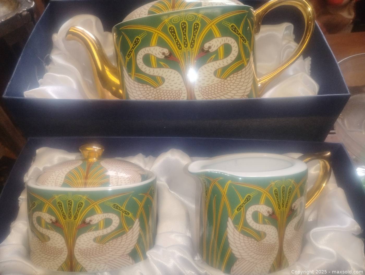 Porcelain swan motif teapot, sugar bowl, creamer with silk-lined ...