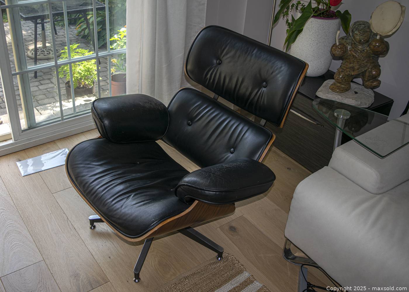 Eames style lounge chair and ottoman replica | Maxsold