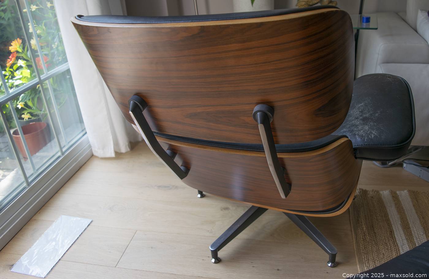 Eames style lounge chair and ottoman replica | Maxsold