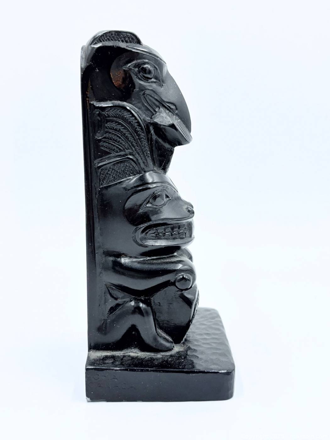 Black carved stone totem figure 6