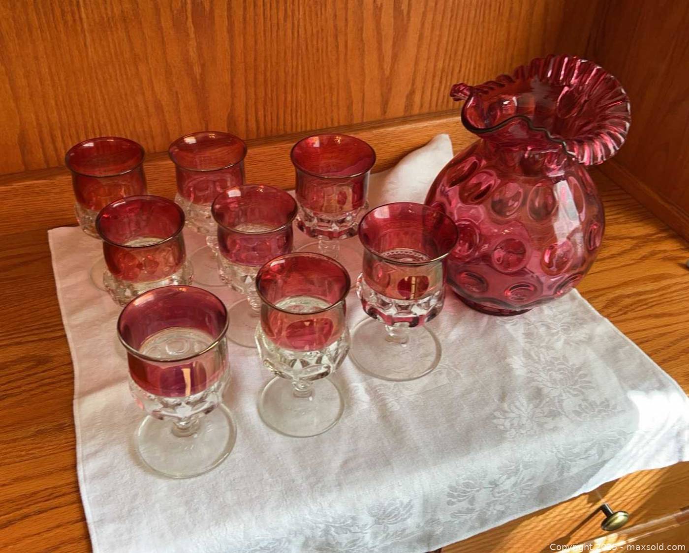Ruby red clear glass pitcher with 9 goblets | Maxsold