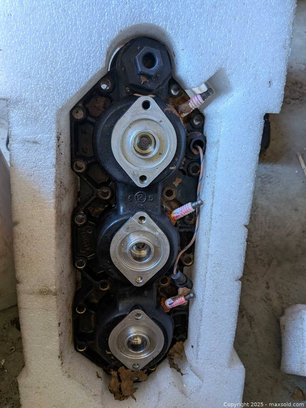 Two outboard engine cylinder heads | Maxsold
