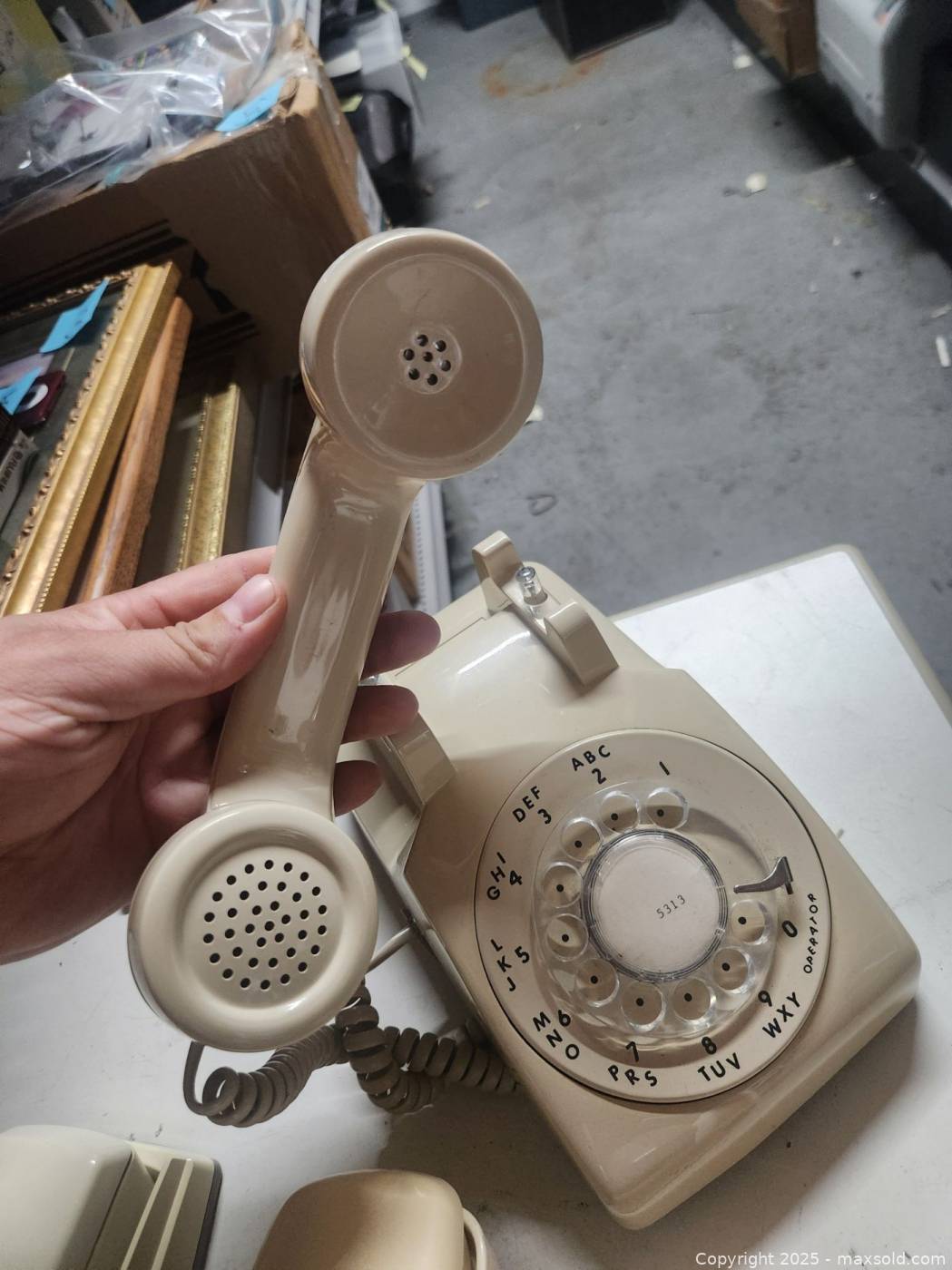 Four cream-beige landline telephones | Maxsold